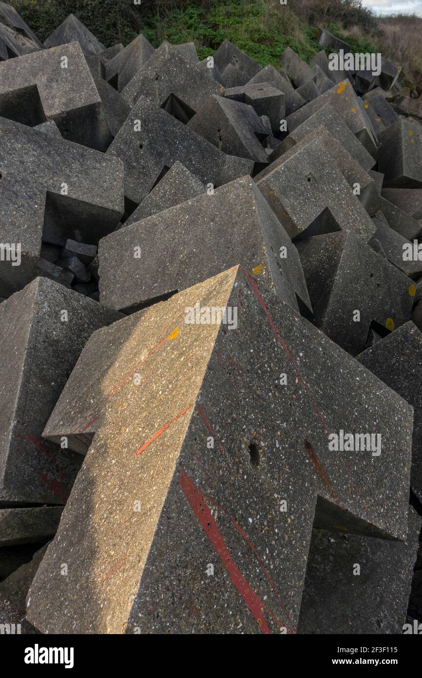 Sea defence blocks placed to stop erosion on the beach at Grain Kent ...