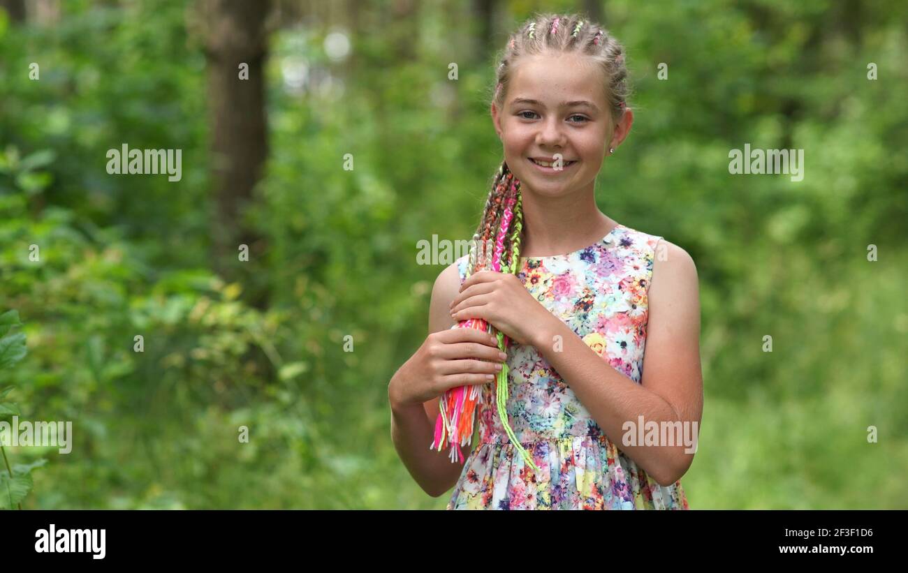 Teenage girl with multi-colored dreadlocks in the forest Stock Photo ...
