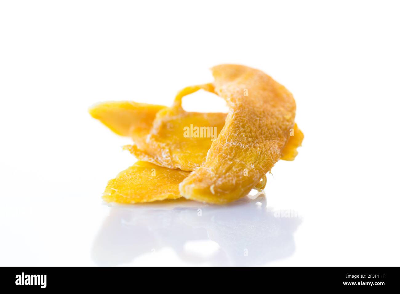 slices of sweet ripe dried mango isolated on white background Stock ...