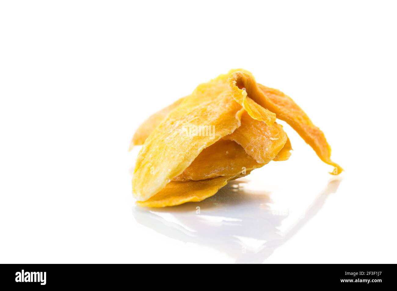 slices of sweet ripe dried mango isolated on white background Stock ...