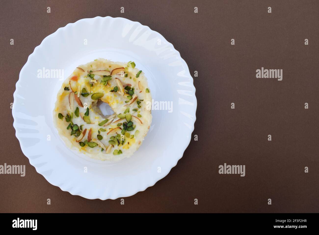 Traditional and authentic halwai style Indian sweet dish called Ghevar ...