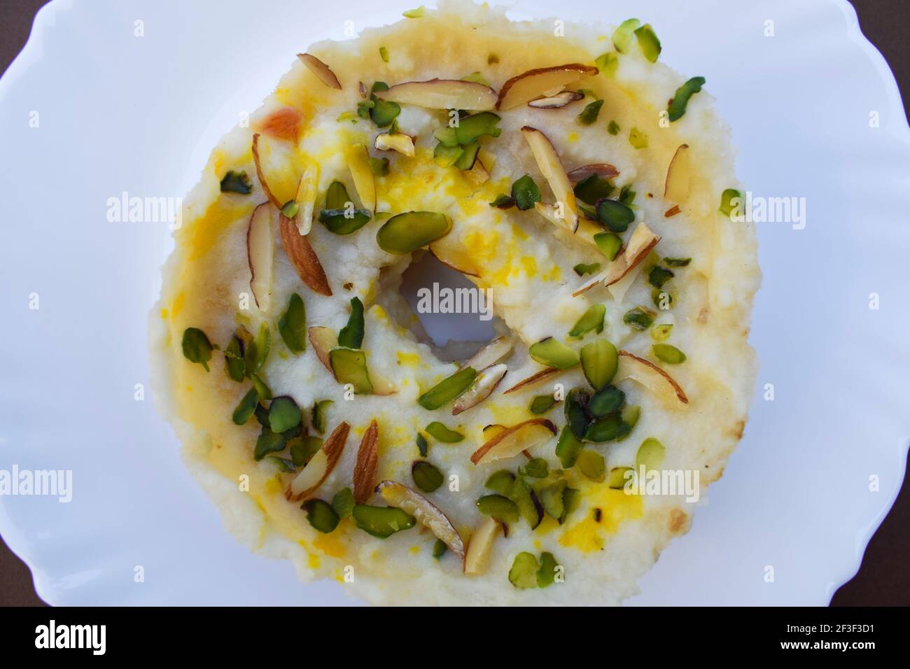 Traditional and authentic halwai style Indian sweet dish called Ghevar ...