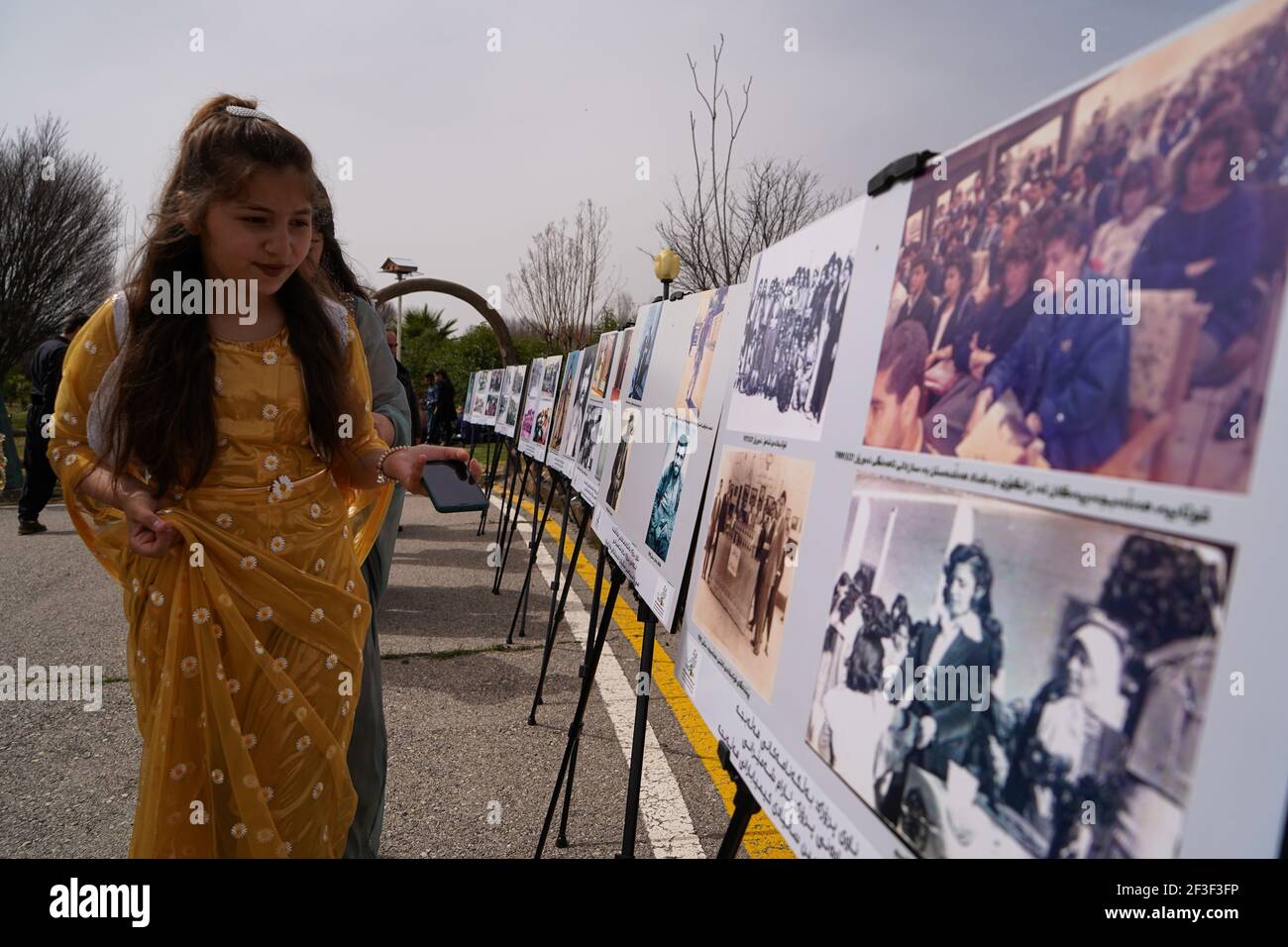 Halabja, Iraq. 16th Mar, 2021. Iraqi Kurds view pictures of the victims ...