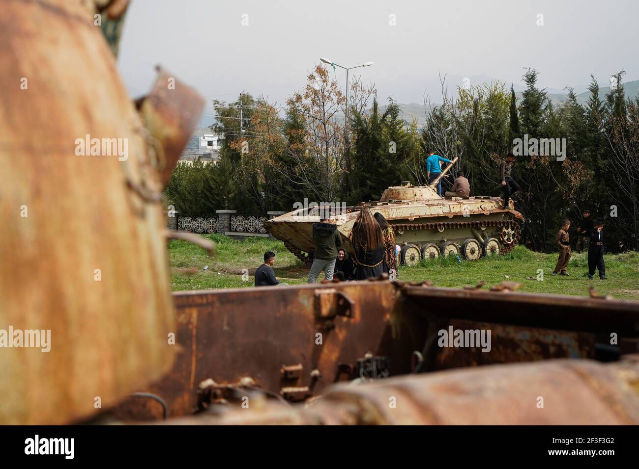 Halabja, Iraq. 16th Mar, 2021. Children play with military vehicles ...