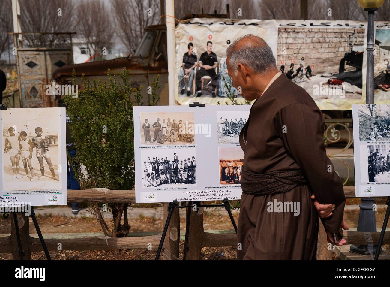 Halabja, Iraq. 16th Mar, 2021. Iraqi Kurds view pictures of the victims ...