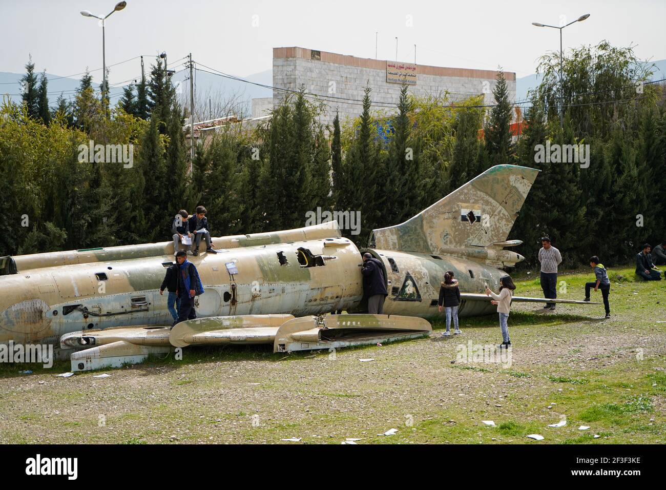 Halabja, Iraq. 16th Mar, 2021. Children play with military plane that ...