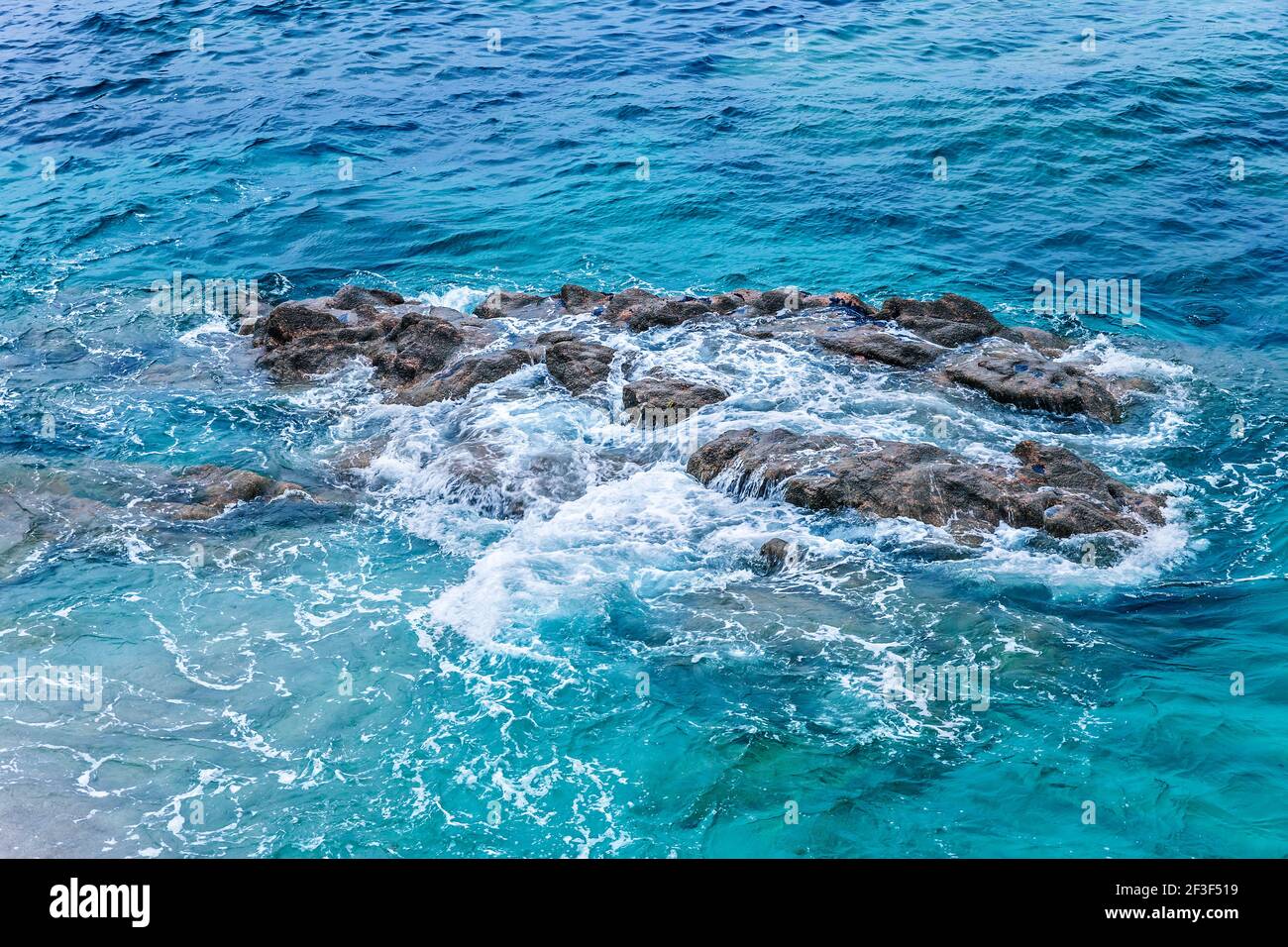 blue landscape with sea breaks on rocks Stock Photo - Alamy