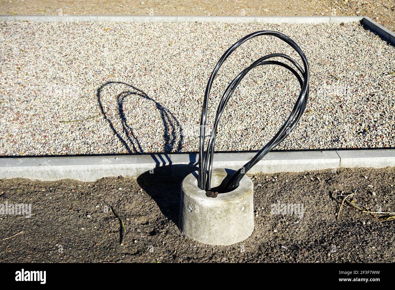 street lighting lantern pole base with supply cables at the street ...