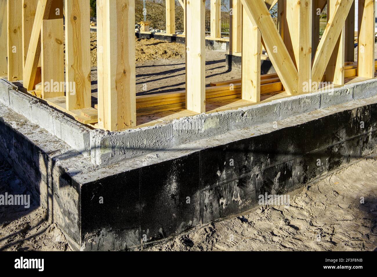 new modern wooden house frame concrete foundation waterproofing and ...