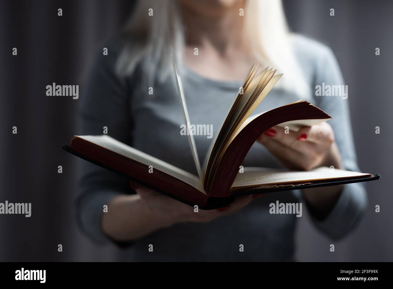 Open book novel lap hi-res stock photography and images - Alamy