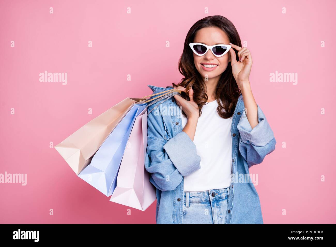 Photo of young pretty lady look sale shopping hold bags wear sunglass ...