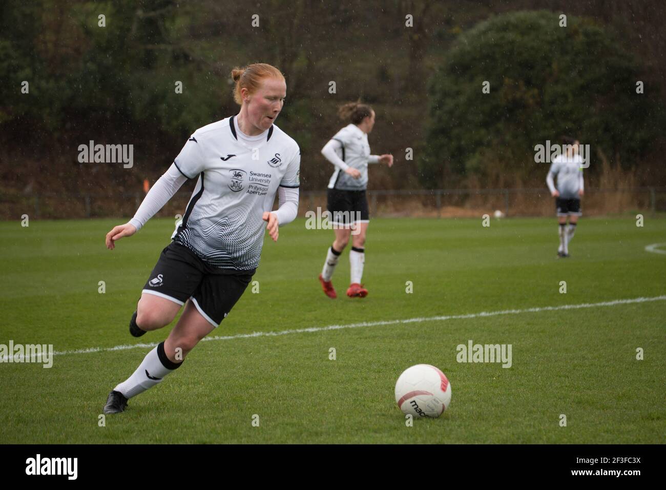 Llandarcy, UK. 14th Mar, 2021. Shaunna Jenkins (#4 Swansea City) in ...