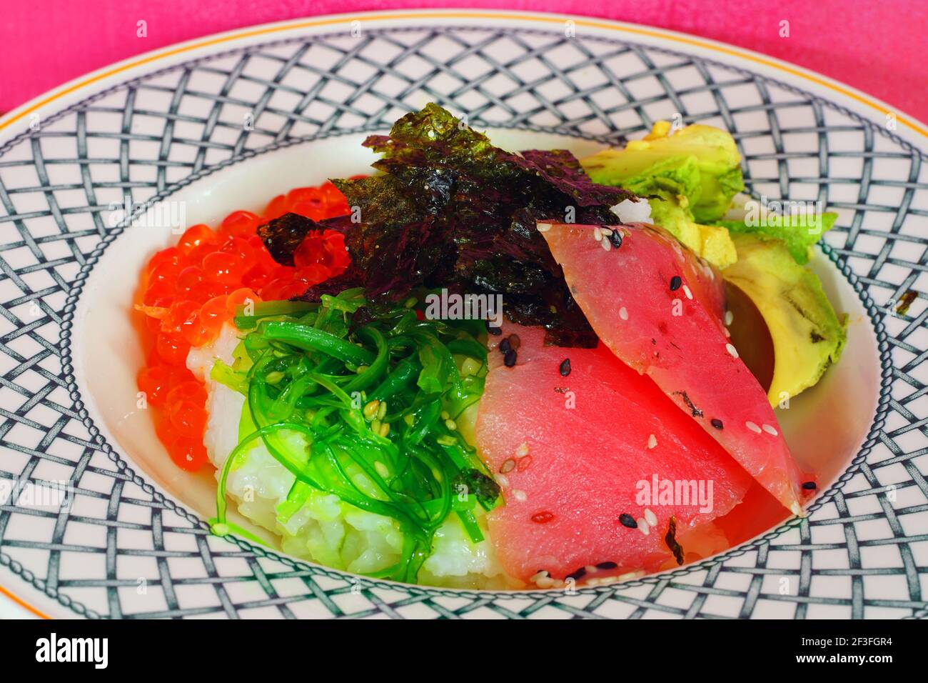 Asian green rice bowl with smoked Ahi tuna slices, salmon roe, cucumber ...
