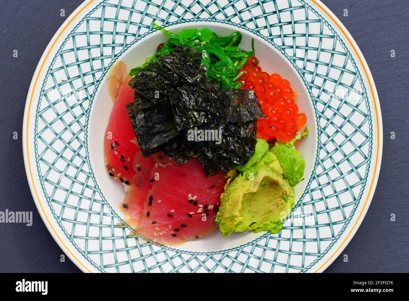Asian green rice bowl with smoked Ahi tuna slices, salmon roe, cucumber ...