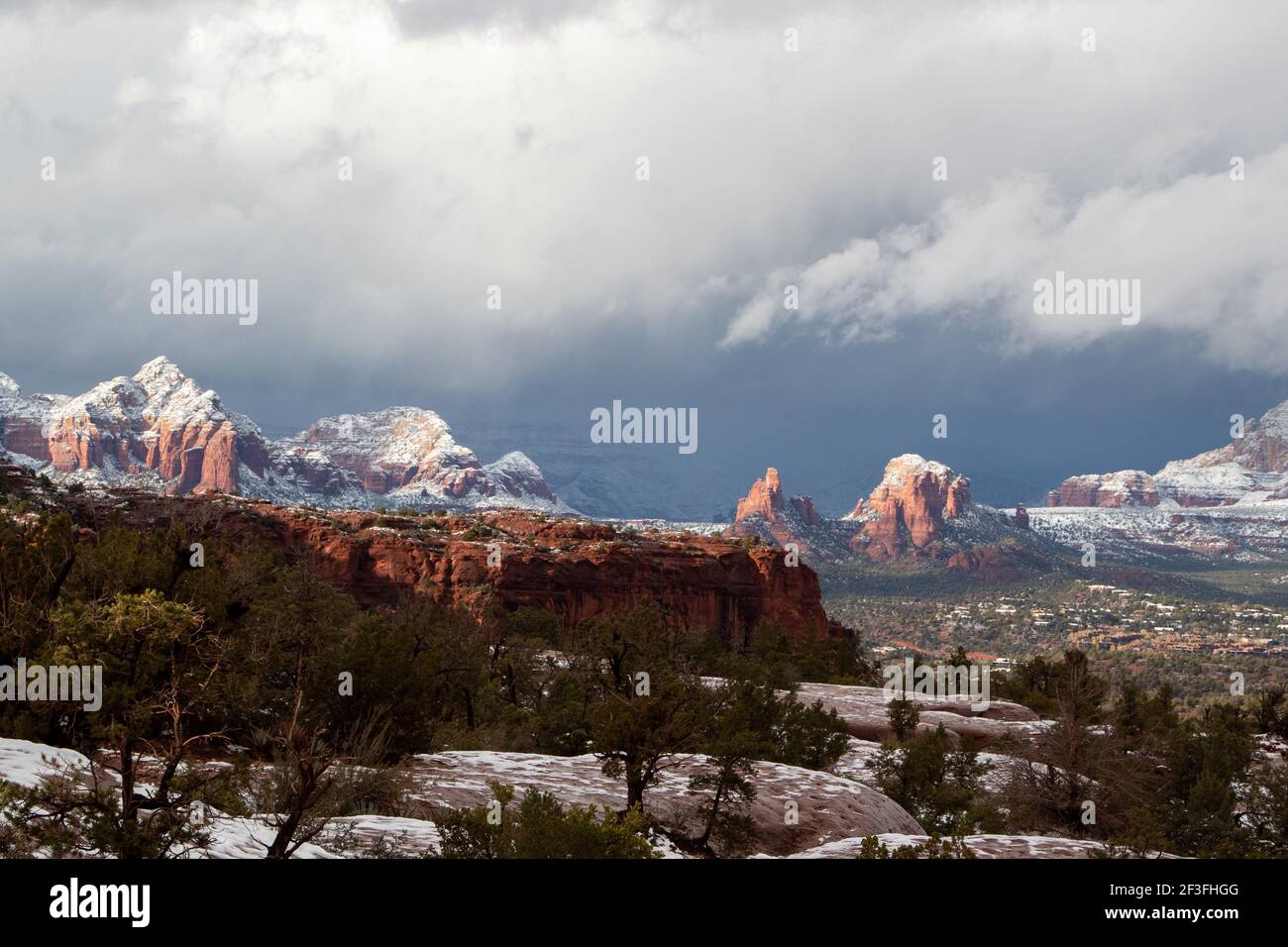An aerial view of rocky mountains with trees in the foreground Stock ...