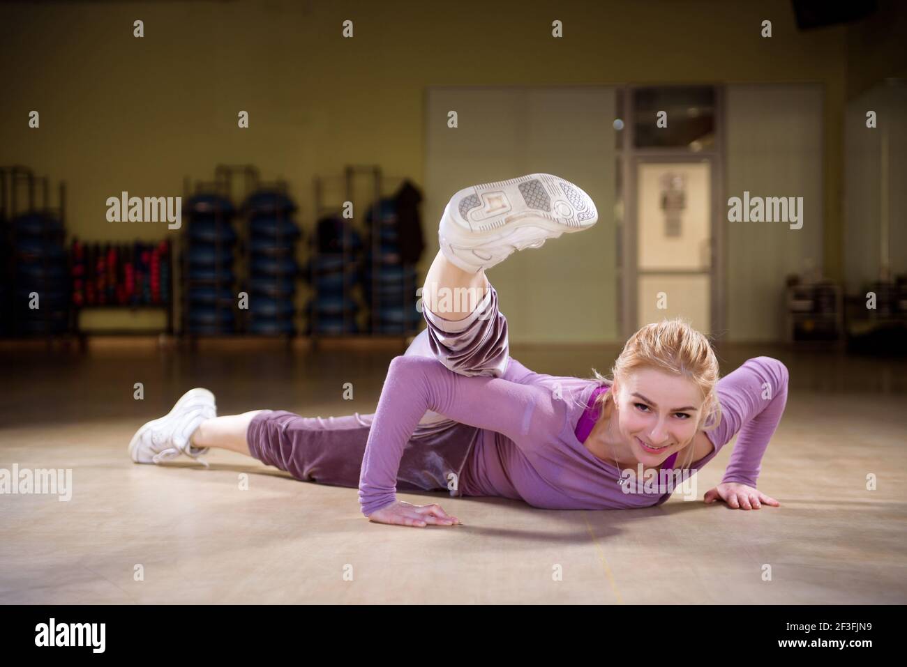 Young sports trainer dancing in the gym Stock Photo - Alamy