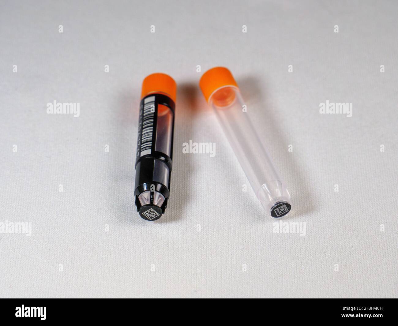 2D barcoded tubes for biological sample storage. Jacketed on left, non-jacketed, on right Stock ...