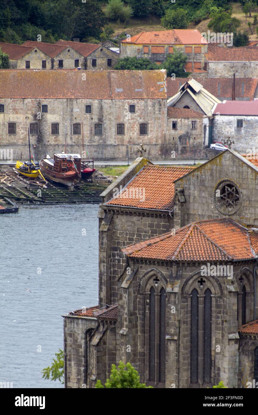A vertical shot of a part of ancient cathedral near the river on the ...