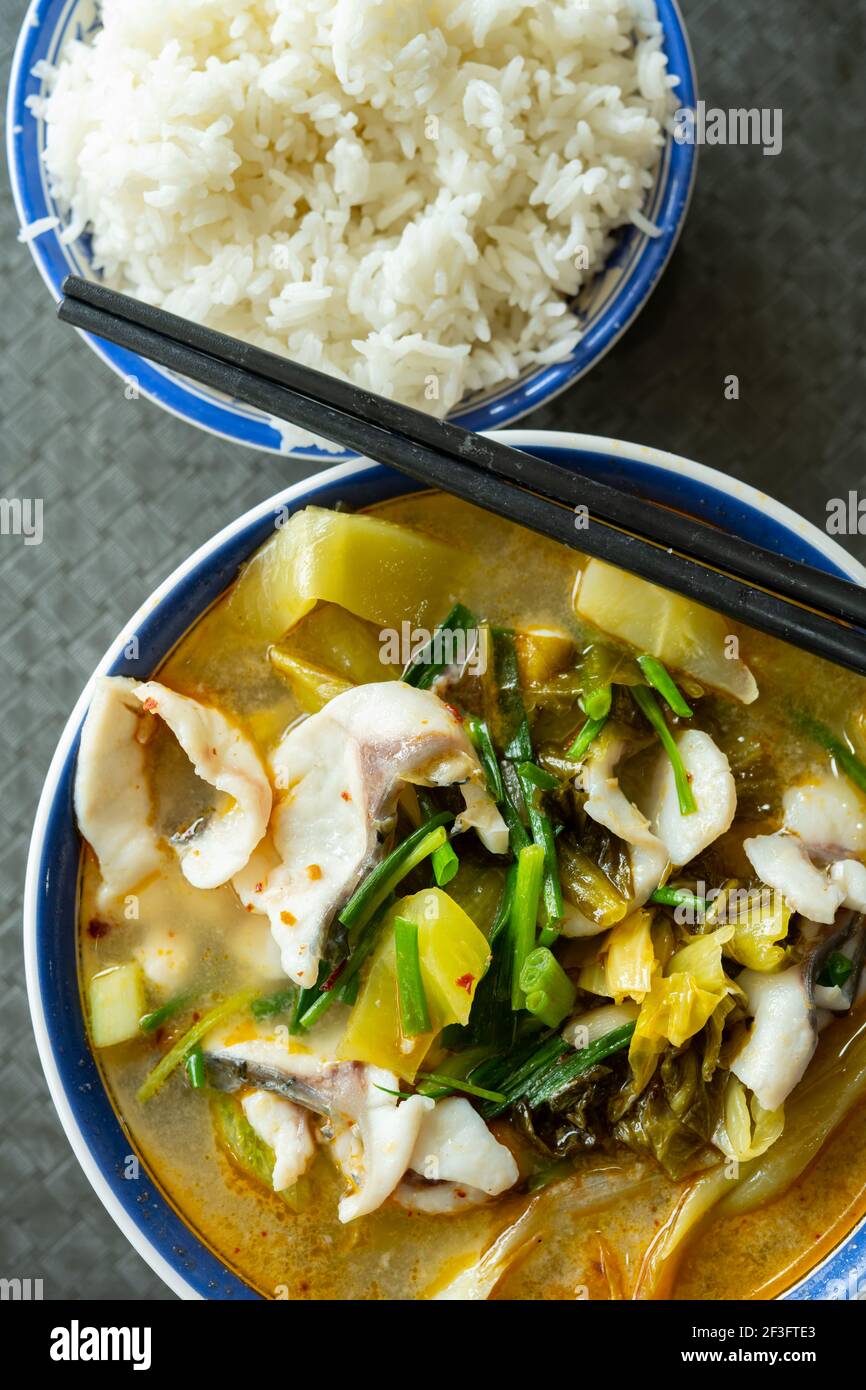 top view fast food of spicy boiled fish with rice vertical composition ...