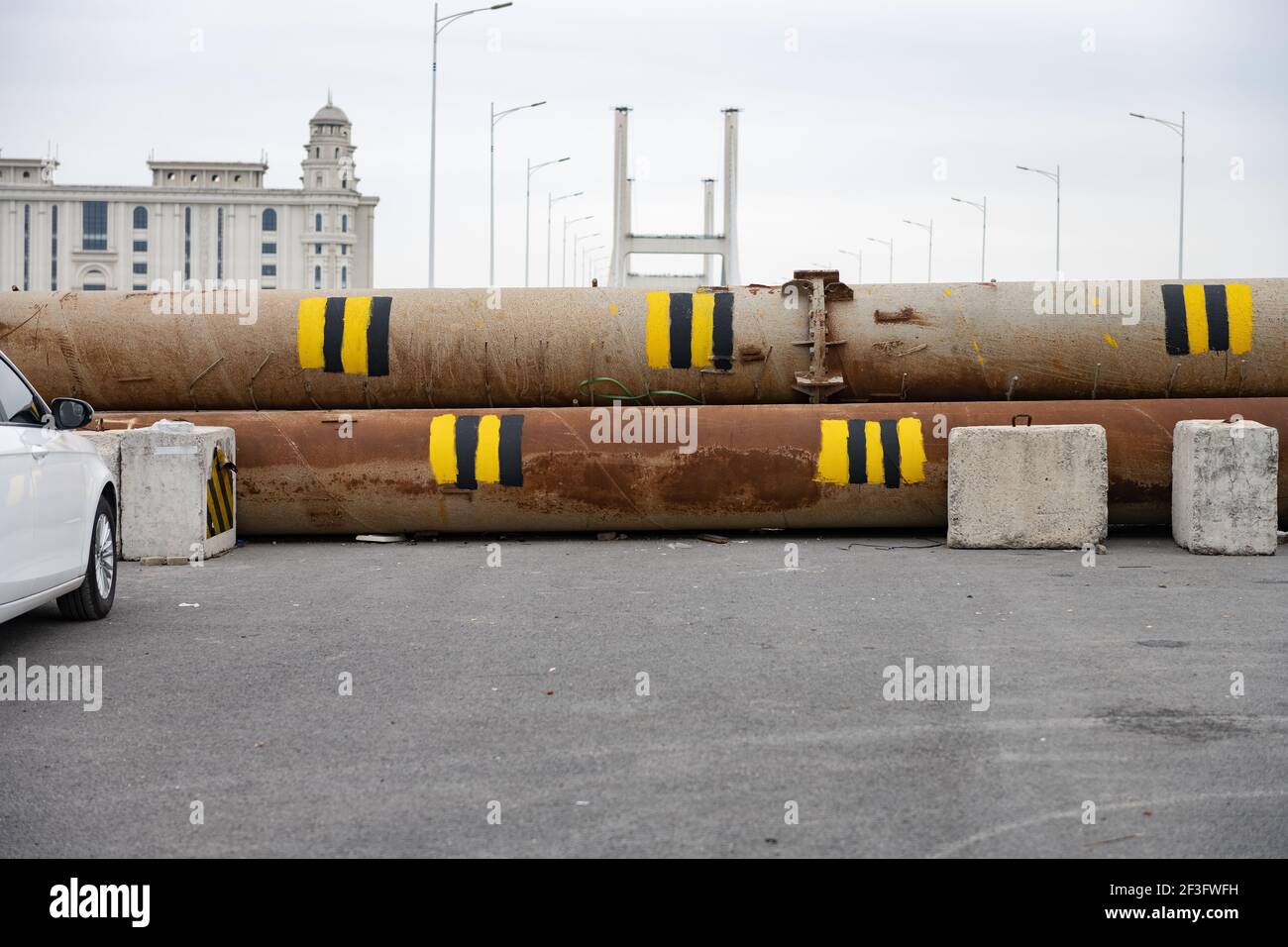 big steel pipes as a road block Stock Photo - Alamy