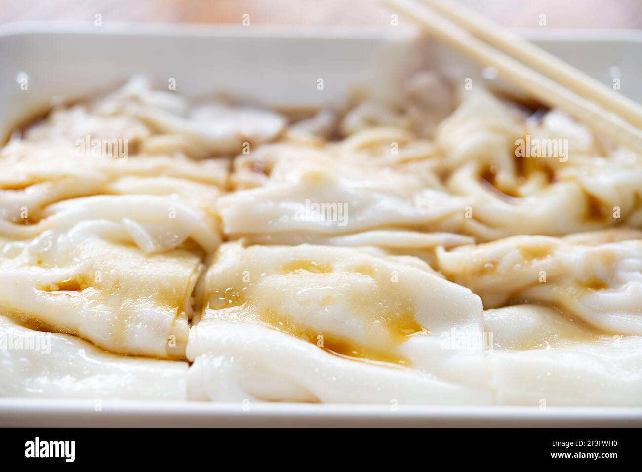 side view traditonal Cantonese food of cheong fun or rice noodle rolls ...