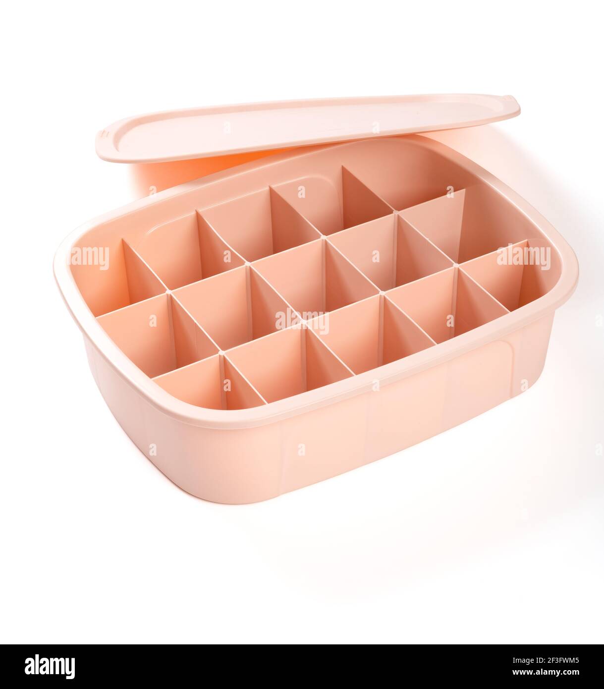 plastic box with small spaces on white Stock Photo - Alamy