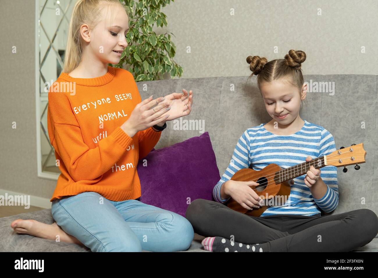 Ukulele women hi-res stock photography and images - Alamy