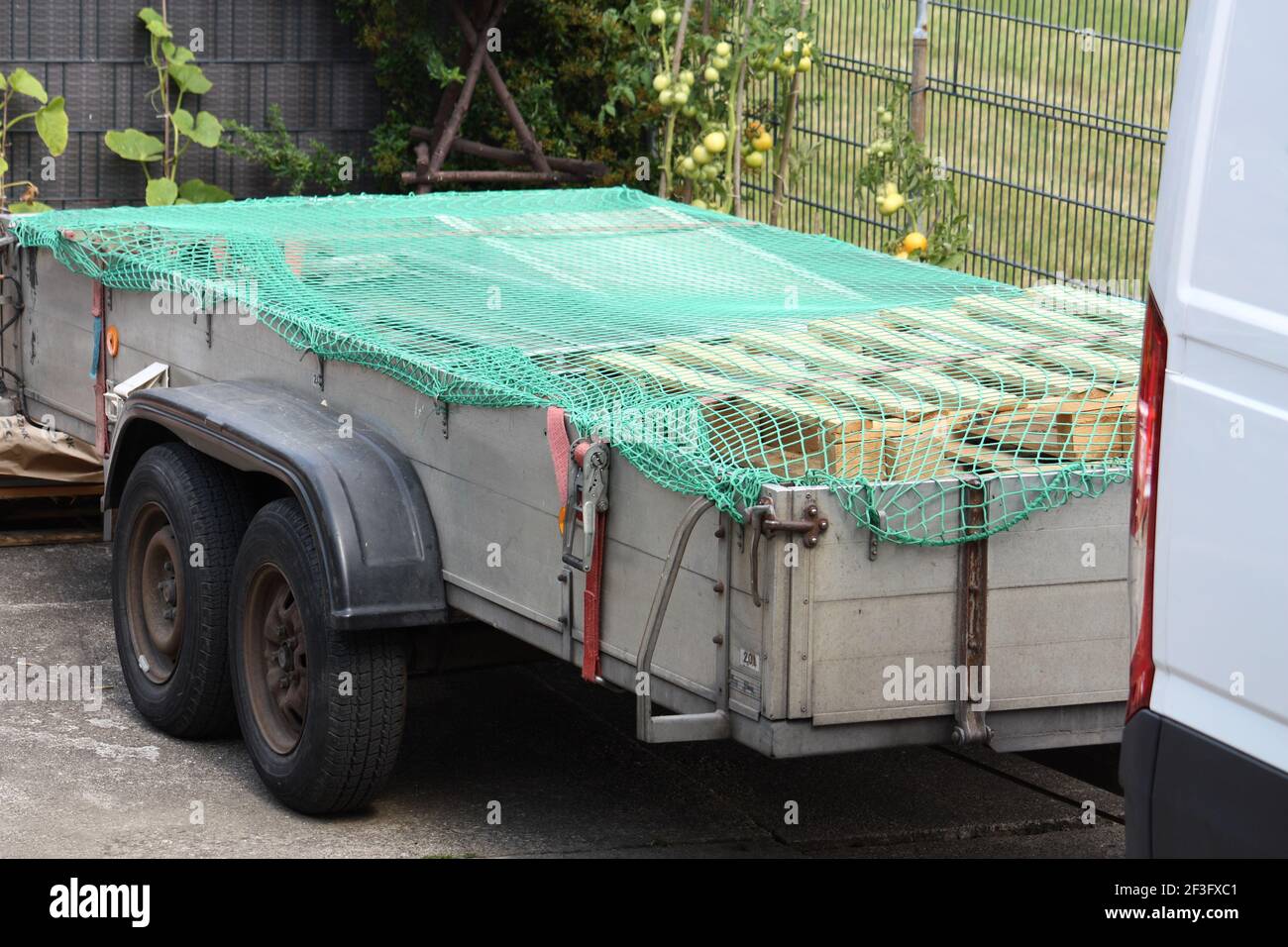 A green cargo trailer net Stock Photo - Alamy
