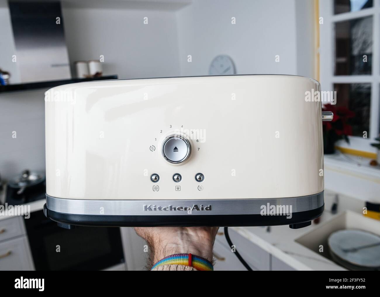 POV male hand holding new KitchenAid 5KMT4116EAC toaster luxury product ...