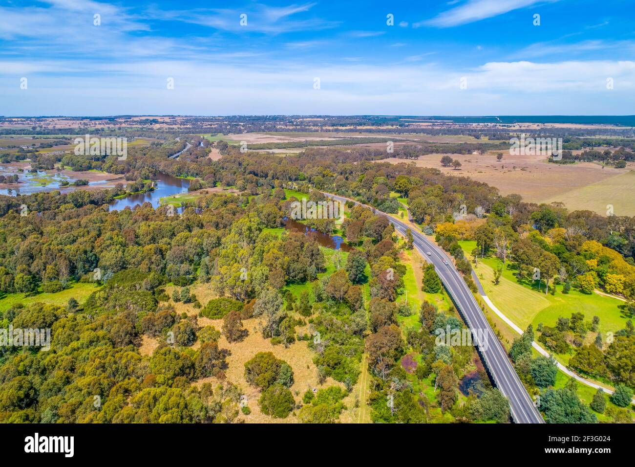 Aerial view of Thomson River and rural highway near Sale, Victoria ...