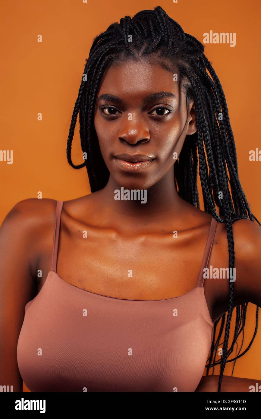 pretty young african american woman with braids posing cheerful ...