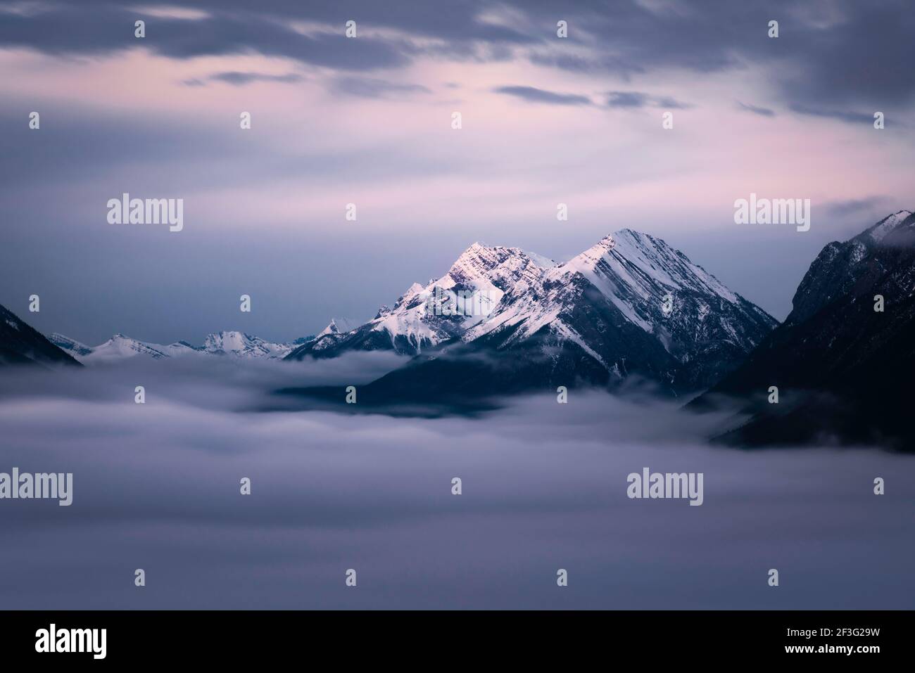 A cloud inversion fills the valley in Banff National Park as the clouds ...