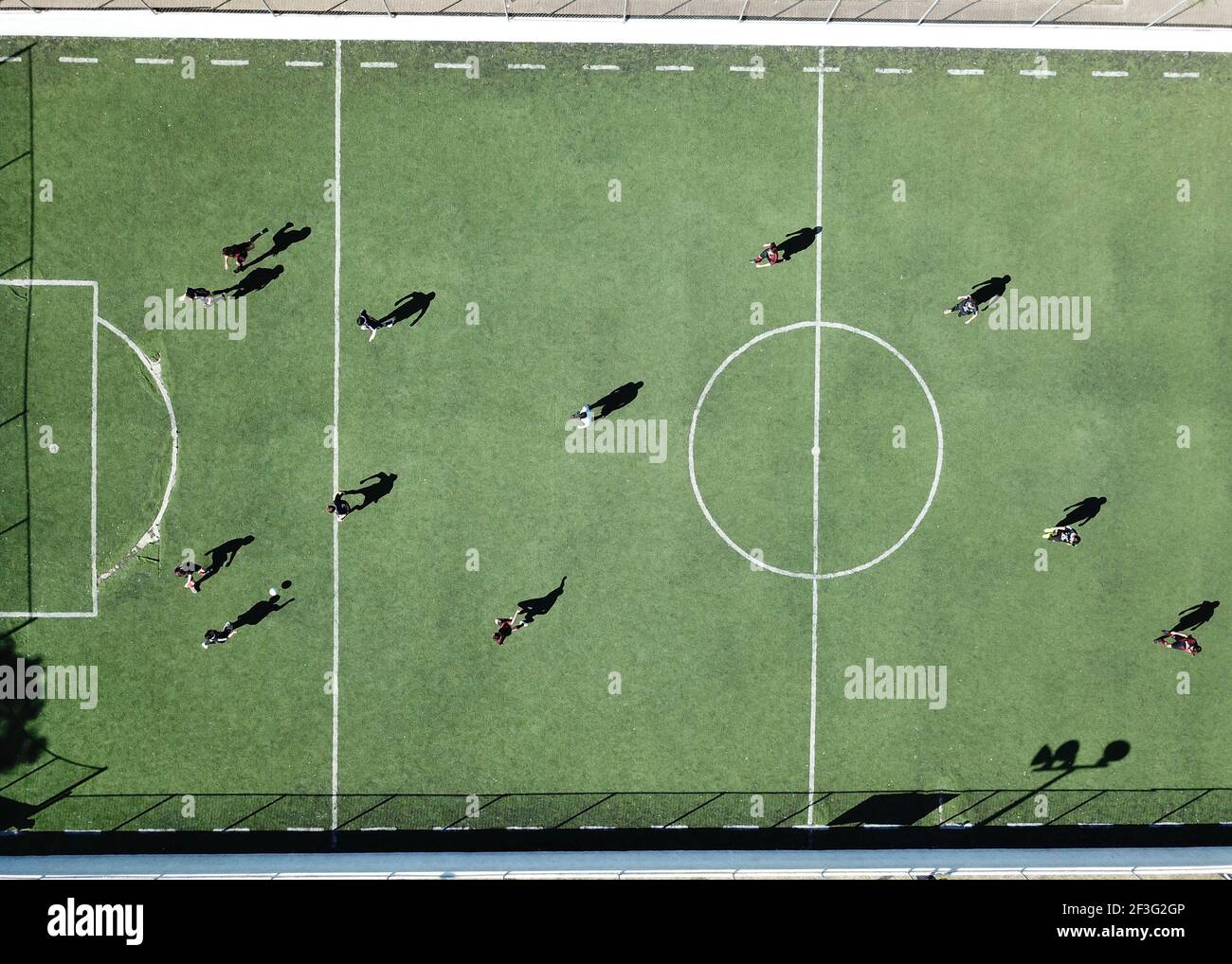An aerial downward view of people playing football Stock Photo - Alamy
