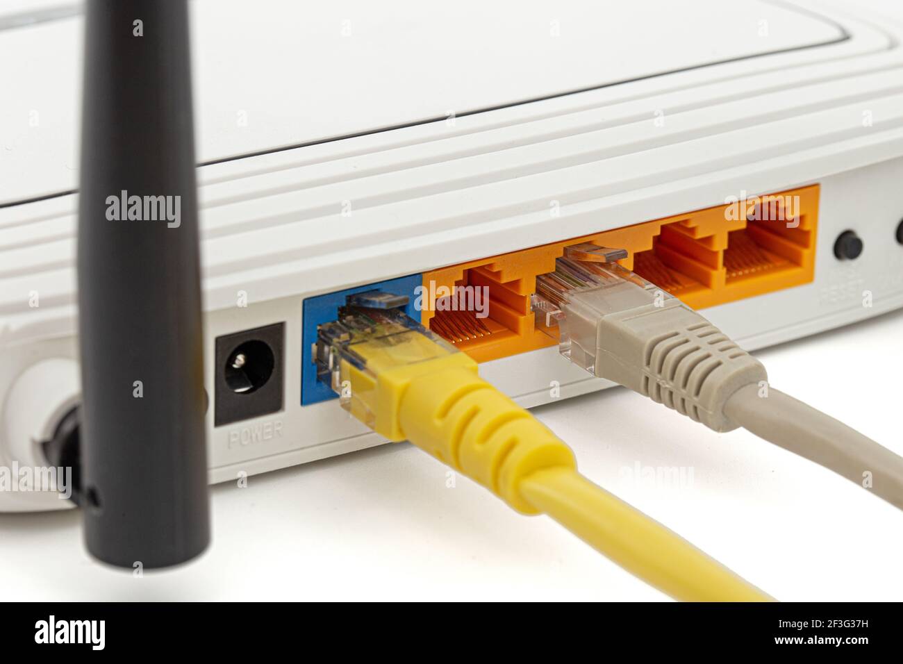 Wireless router with cables, isolated on white background Stock Photo ...