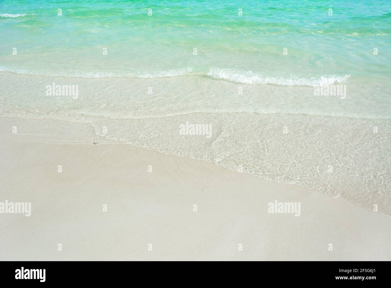 White sand beach with crystal clear sea water Stock Photo - Alamy