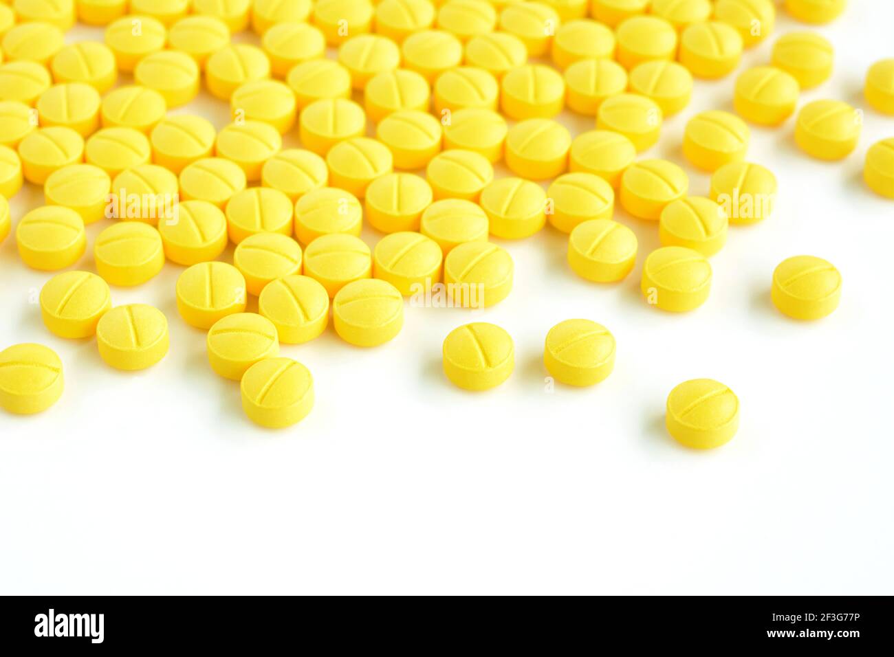 Small medicine tablets (or pills) on white background Stock Photo - Alamy