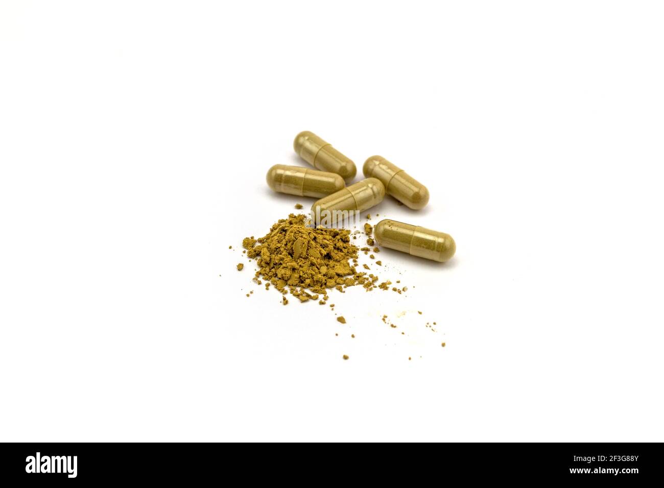 Herbal capsule and powder on white background Stock Photo - Alamy