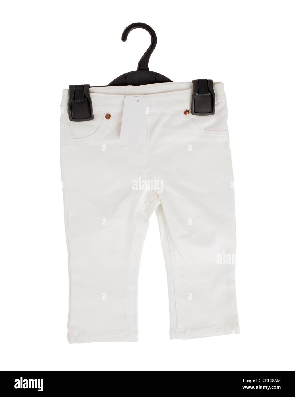 White denim shorts on black plastic hanger with blank label. Isolated ...