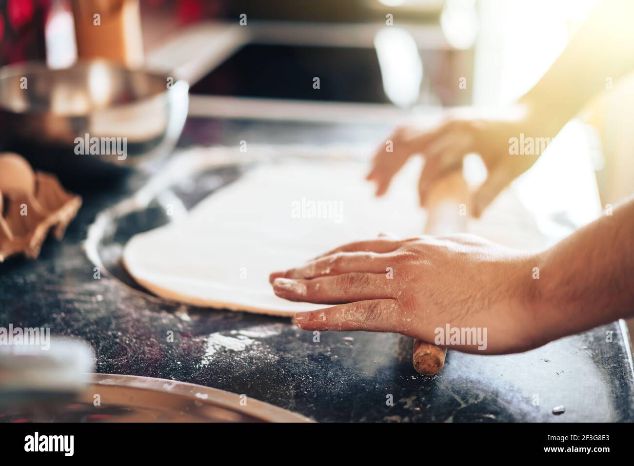 Man rolls dough rolling pin hi-res stock photography and images - Alamy