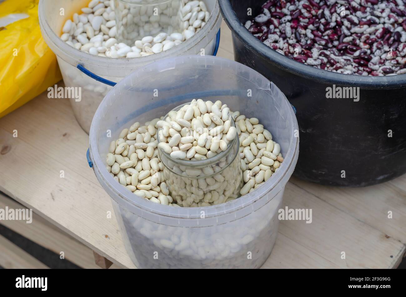 Different varieties of dry beans on the counter of the local market ...