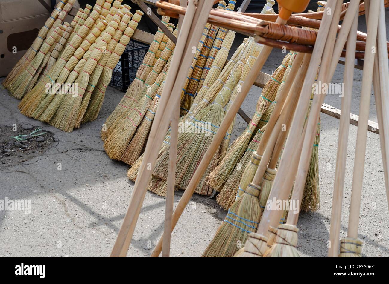 New millet brooms with long and short handles. Handmade brooms on the ...