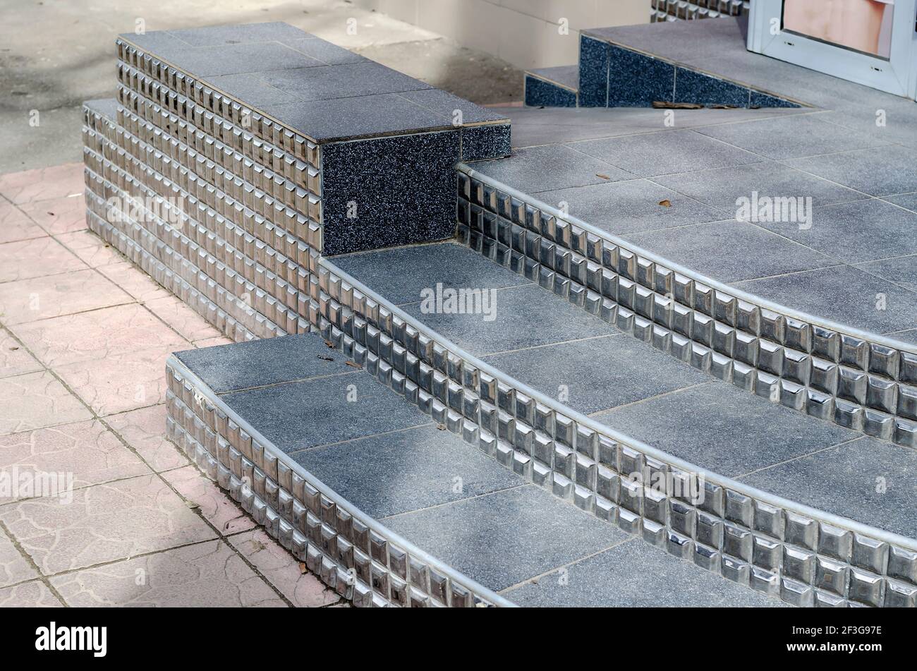 Fragment of black steps and ramp for the disabled. Entrance to the ...