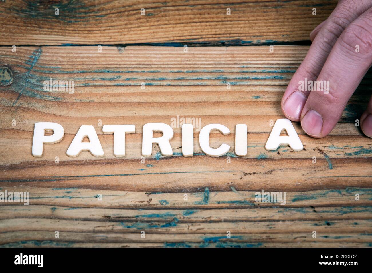 PATRICIA. Name of women and girls. White letters of the alphabet on a ...