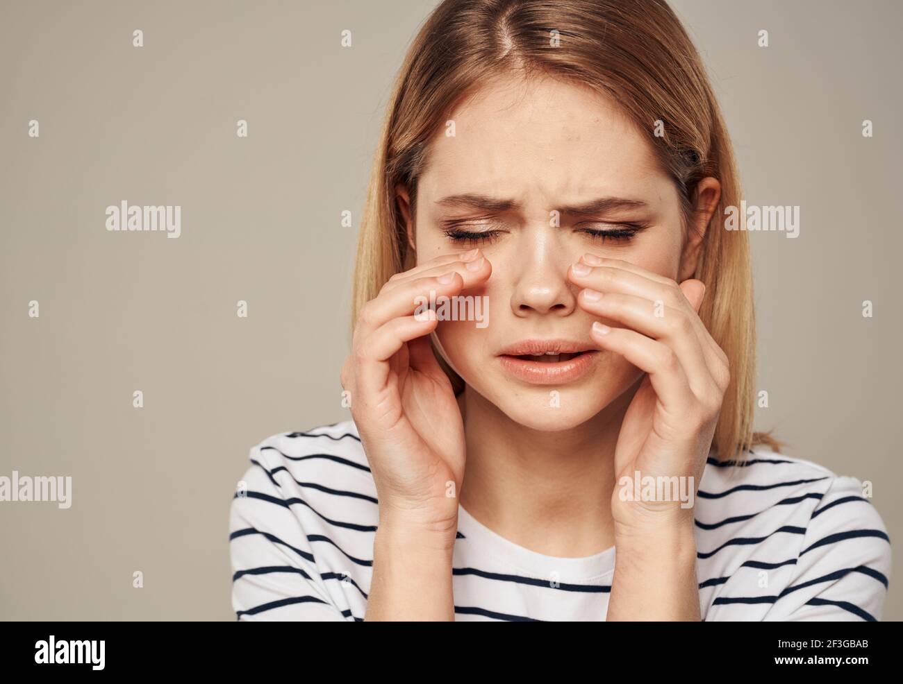 upset woman crying on beige background emotions cropped view Stock ...