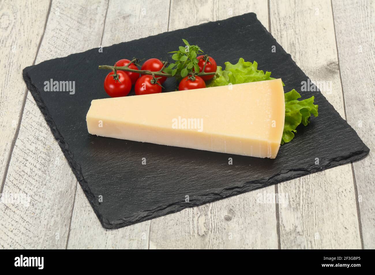 Italian traditional parmesan cheese triangle served salad Stock Photo ...