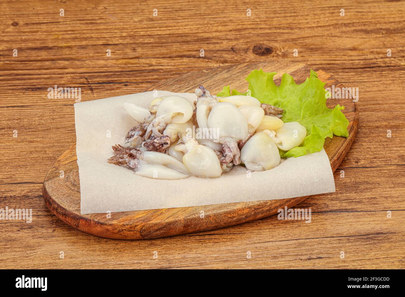 Raw seafood - cuttlefish for cooking over board Stock Photo - Alamy