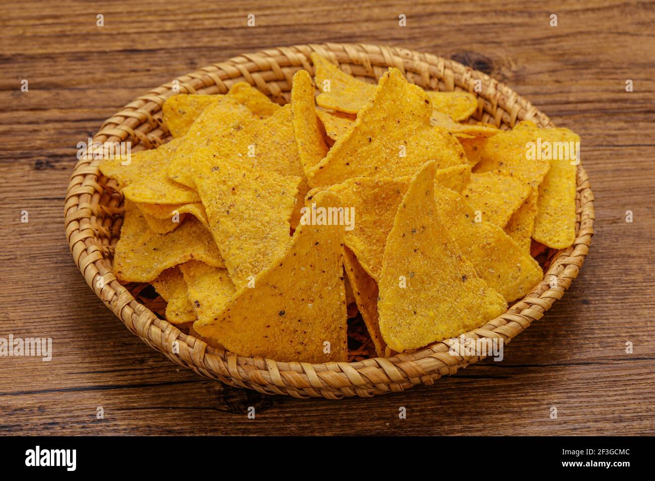 Mexican crunchy corn nachos triangle heap Stock Photo - Alamy