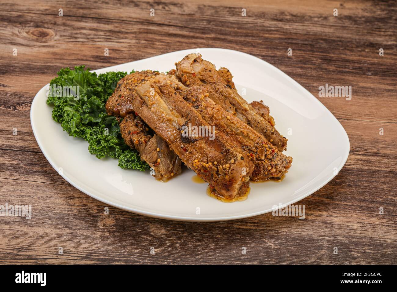 Stewed pork ribs with spices and herbs Stock Photo - Alamy