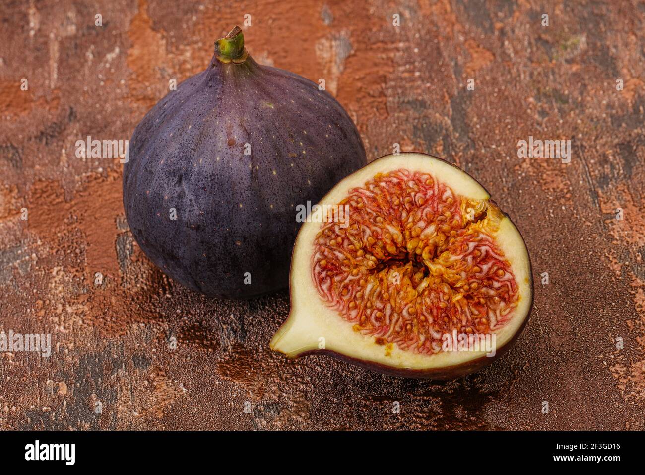 Sweet purple slice of fig fruit Stock Photo - Alamy