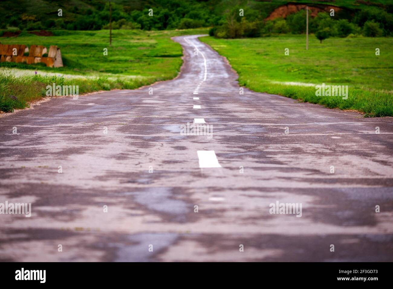 Empty old asphalt road with line in rural area Stock Photo - Alamy